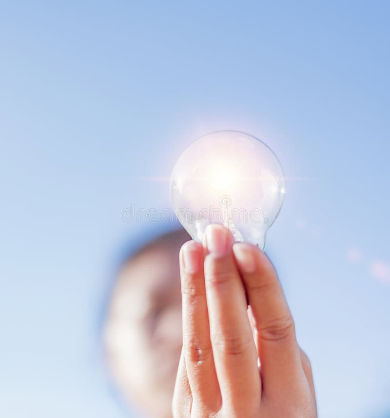 Hand holding a light bulb. stock photo. Image of brainstorm - 244319144