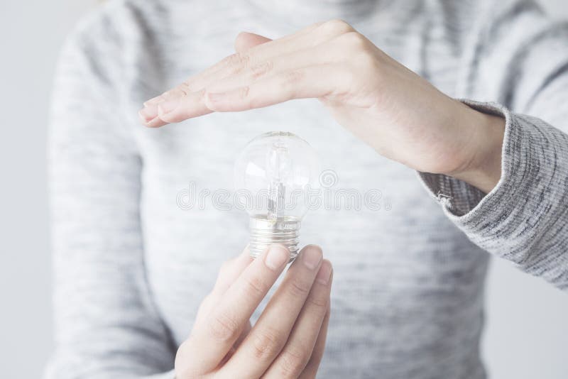 Hand holding a light bulb stock image. Image of bulb - 119711945