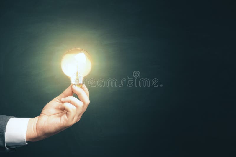 Hand holding light bulb stock image. Image of discovery - 168029577