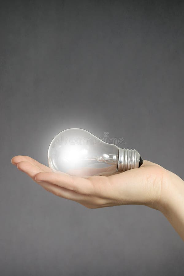 Hand with light bulb stock photo. Image of ecology, industry - 29992562