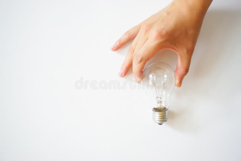 A Hand is Holding a Light Bulb Stock Photo - Image of abstract ...