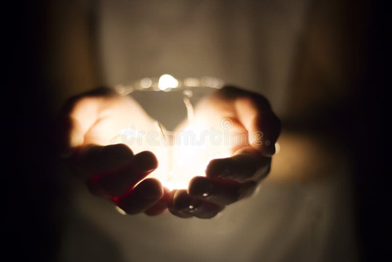 Cupped Hands Holding a Glowing Light Stock Image - Image of cupping ...