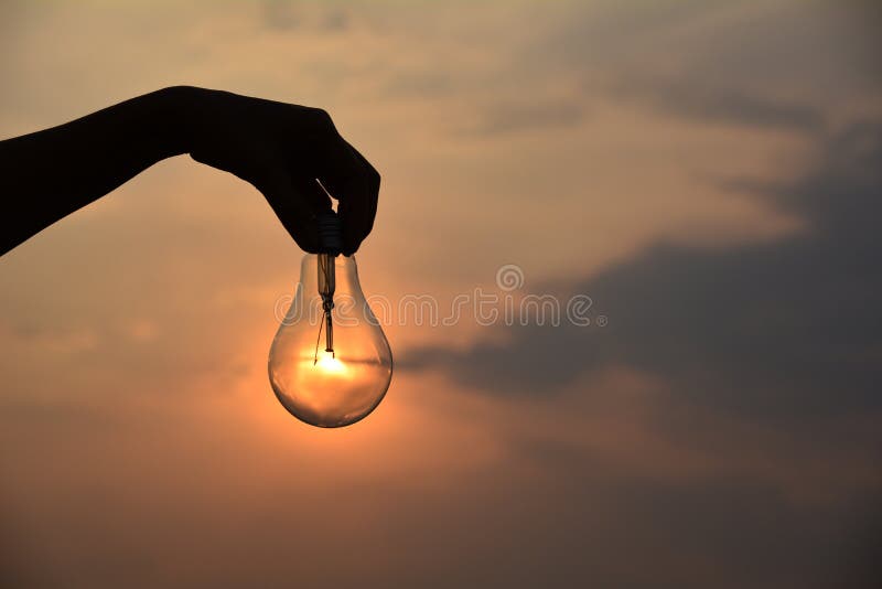Hand Holding Light Bulbs Idea Concept and Silhouette Style Under Stock ...