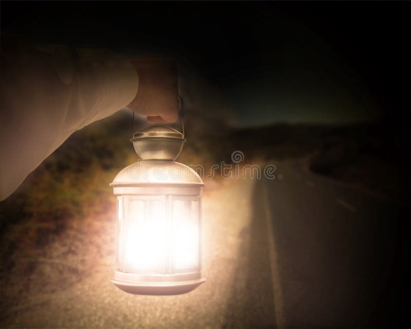 Right Hand Holding Light Illuminating Dark Road at Night Stock Photo ...
