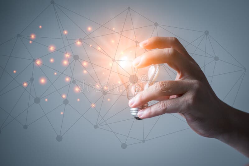A Hand Holding the Light Lamp with Computer Graphic Light Stock Image ...