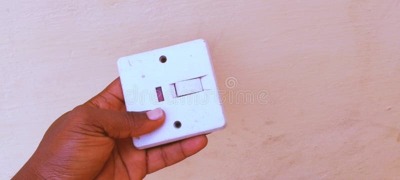 Hand Holding Light Switch for Controlling on and Off Lightning System ...