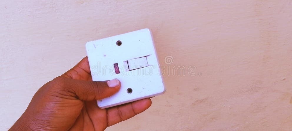 Hand Holding Light Switch for Controlling on and Off Lightning System ...