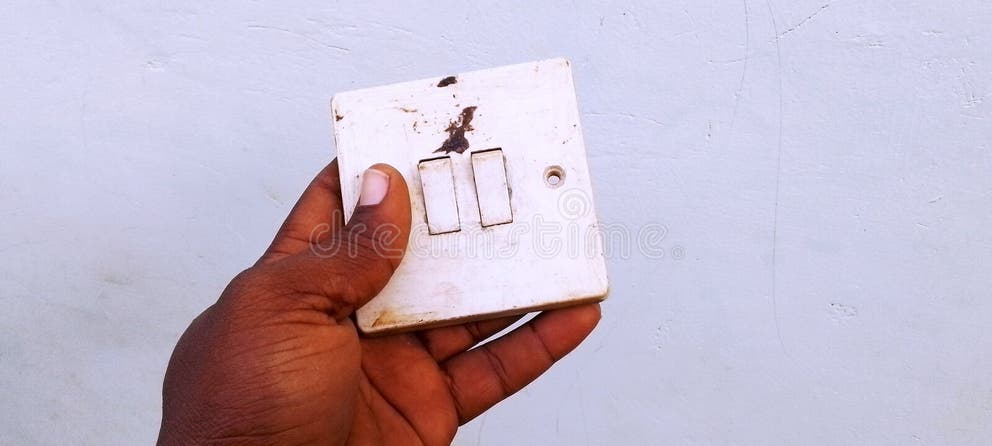 Hand Holding Light Switch for Controlling on and Off Lightning System ...