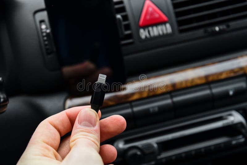 Hand Holding Lightning Cable in Car Interior Stock Photo - Image of ...