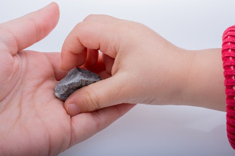 Hand Holding Little Stone in Hand Stock Image - Image of stones ...