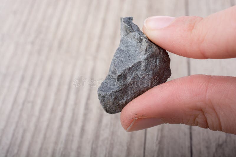 Hand Holding Little Stone in Hand Stock Image - Image of stones, pebble ...
