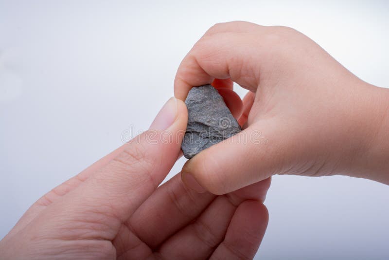 Hand Holding Little Stone in Hand Stock Image - Image of stones, hand ...