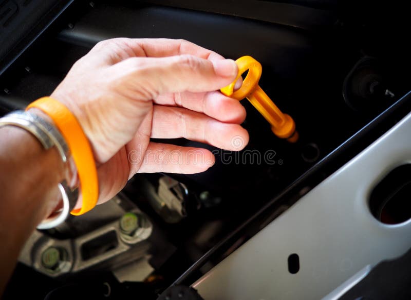 Hand Holding Lubricant Oil Level Check Dipstick Stock Photo - Image of ...