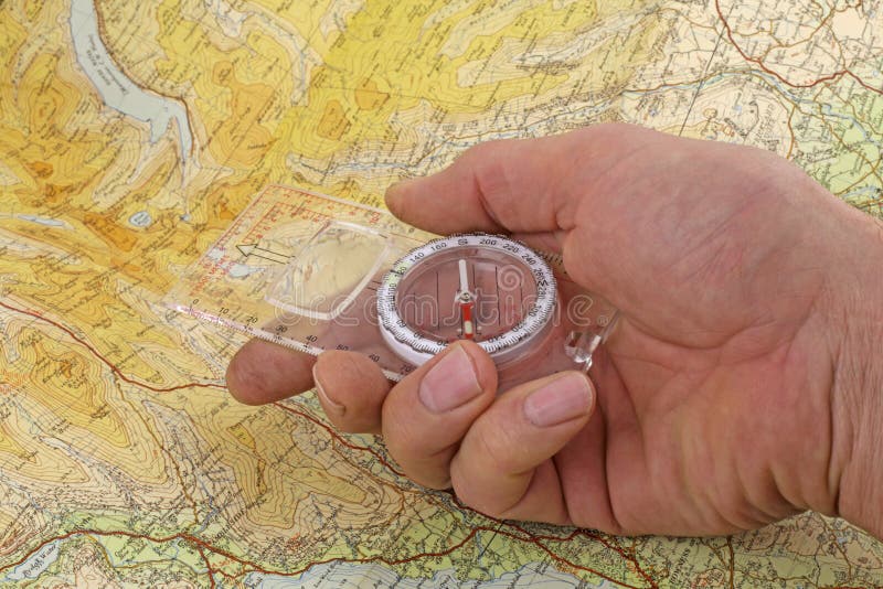 Hand, compass and map stock photo. Image of compass - 112785864