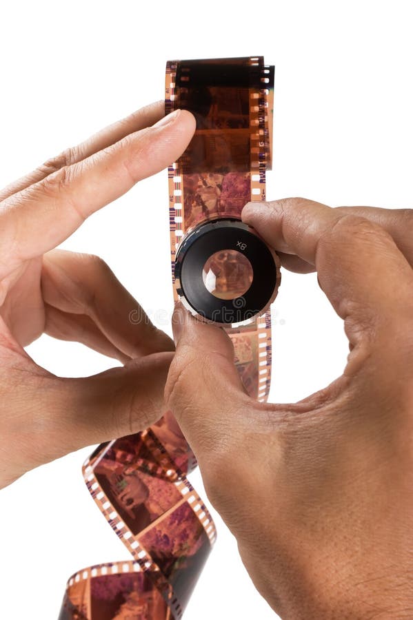 Hand Holding Magnifying Glass and Film Stock Image - Image of isolated ...
