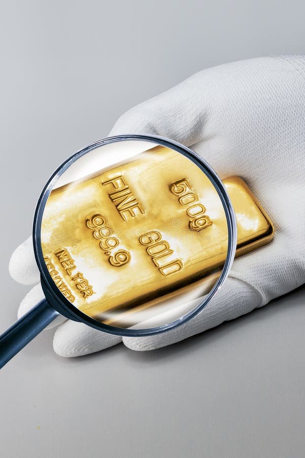 Hand Holding Magnifying Glass with Gold Bar Stock Photo - Image of ...