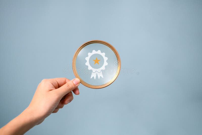 Hand Holding Magnifying Glass with Virtual Certification of Quality ...