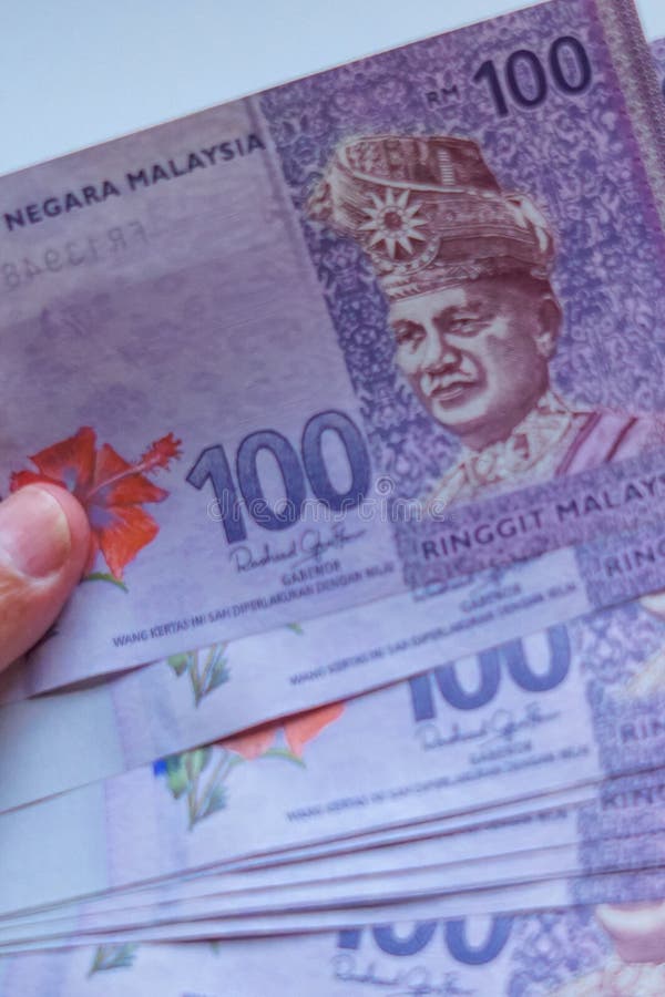 Hand Holding Malaysian Ringgit and Money Packet Stock Image - Image of ...