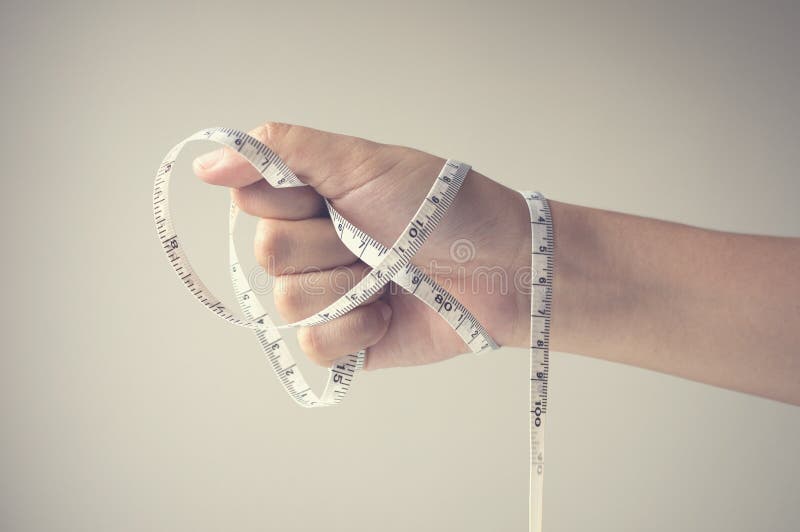 Hand Holding Measuring Tape. Stock Photo - Image of female, horizontal ...