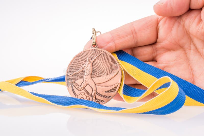 Hand holding medal stock image. Image of trophy, gold - 68601935