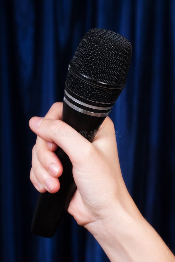 Microphone in hand stock image. Image of karaoke, finger - 26220765