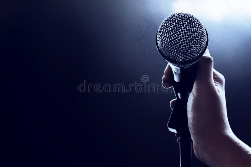 Hand Holding Microphone on Stage Stock Photo - Image of hold, rock ...