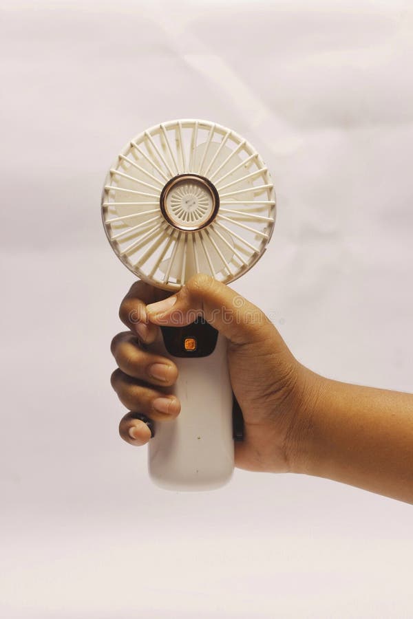 The Hand Holding the Mini Fan Stock Image - Image of people, electrical ...