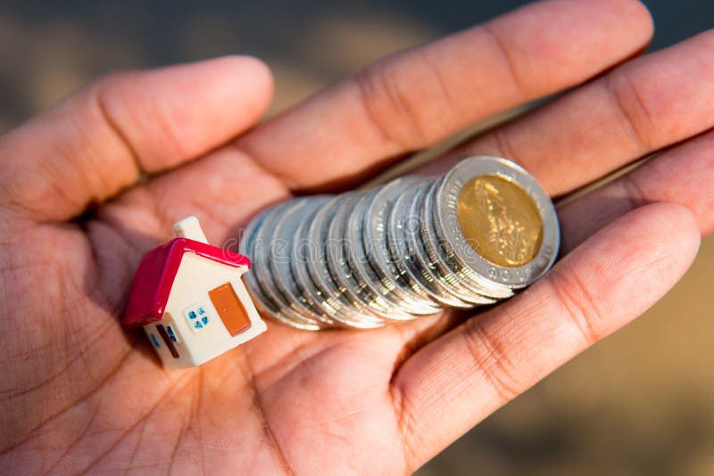 Hand Holding Miniature House and Stack Coins Stock Image - Image of ...