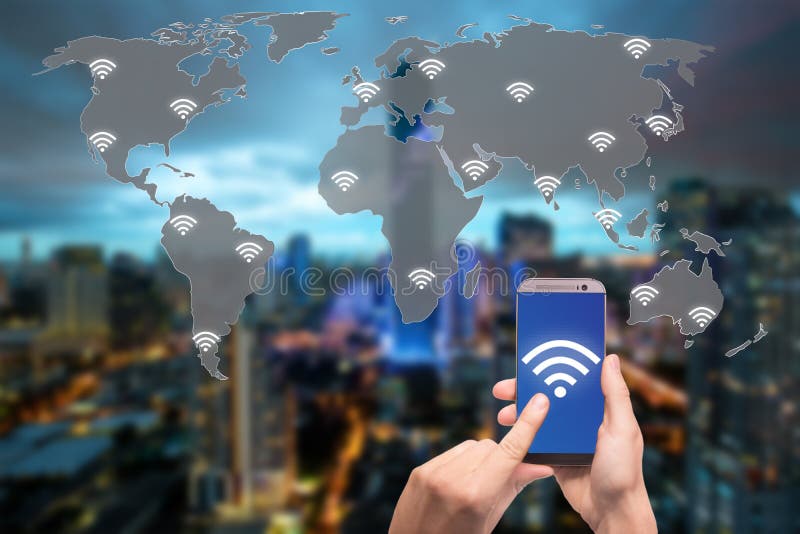 Hand Holding Mobile Phone with Wifi Icon on World Map and City and ...
