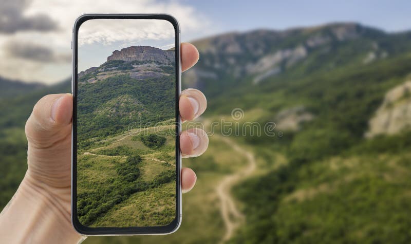 Hand Holding a Mobile Smartphone and Taking Landscape Photography Stock ...