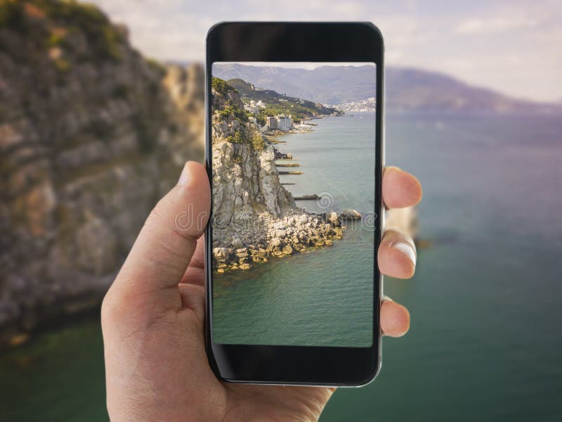 Hand Holding a Mobile Smartphone and Taking Landscape Photography Stock ...