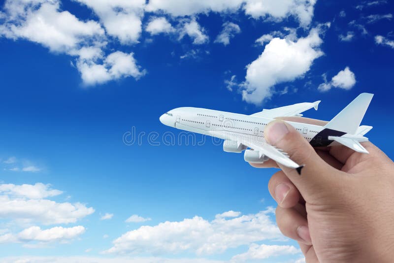 Laptop and airplane stock image. Image of promotion, hand - 23402283