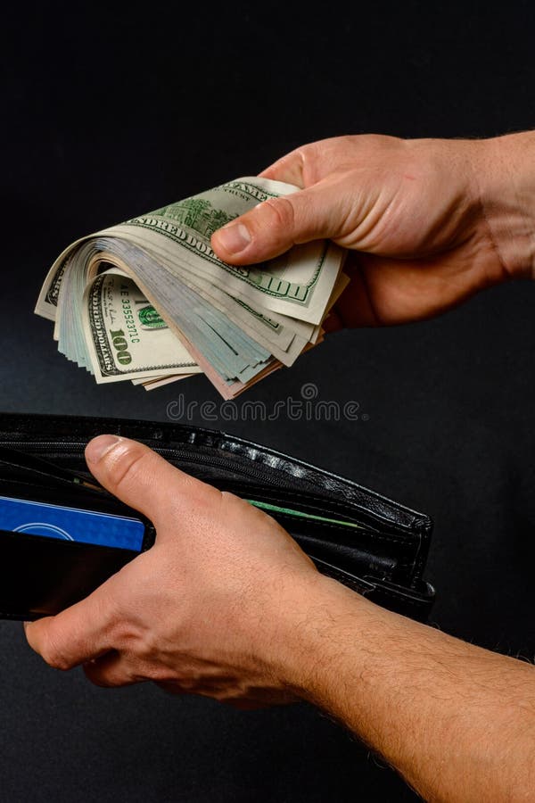 A Hand Holding an Money with Black Wallet Stock Image - Image of ...