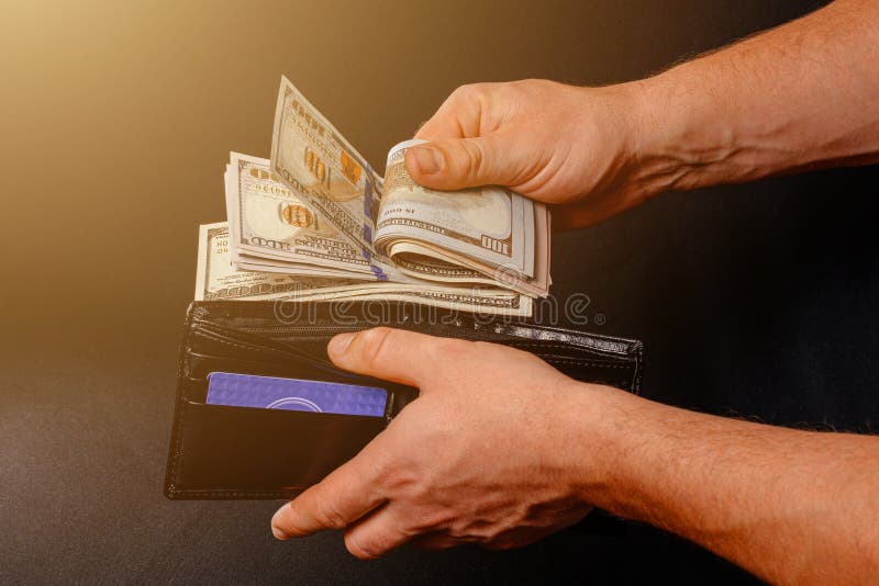A Hand Holding an Money with Black Wallet Stock Image - Image of buying ...