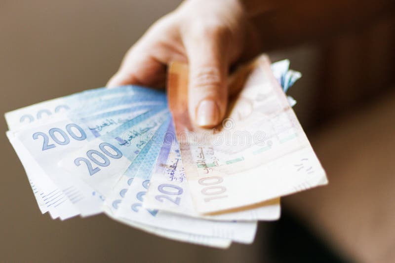 Hand Holding Moroccan Banknotes, Dirham Official Currency of Morocco ...