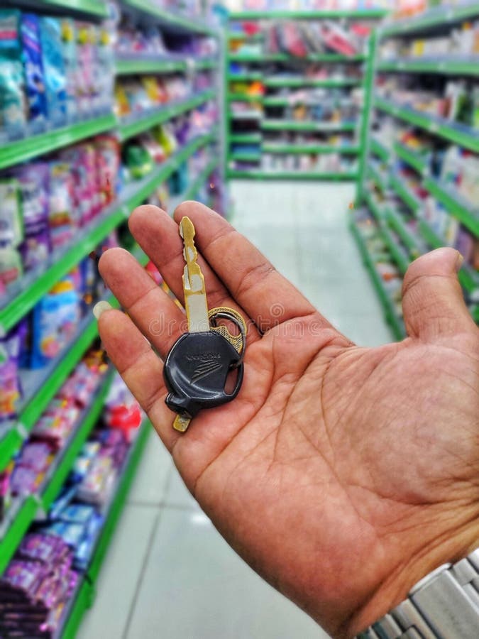 A Hand Holding a Motorbike Key Editorial Stock Image - Image of book ...