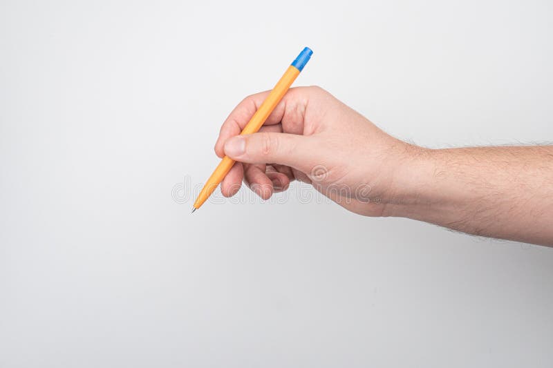 Hand Holding a Moving Yellow Pencil Against a Neutral Background, with ...