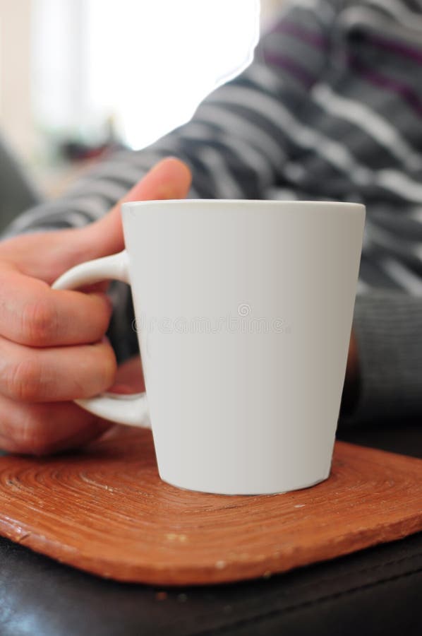 Hand holding mug stock image. Image of beverage, holding - 24415573