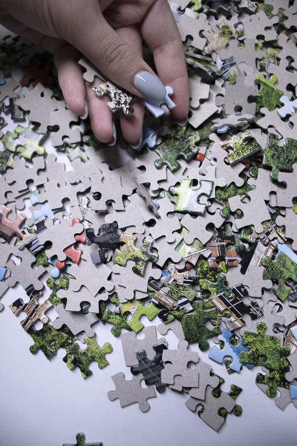 Hand Holding Multicoloured Puzzles on a White Background. Stock Photo ...