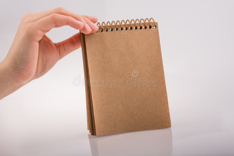 Hand holding a notebook stock image. Image of notepaper - 69549523