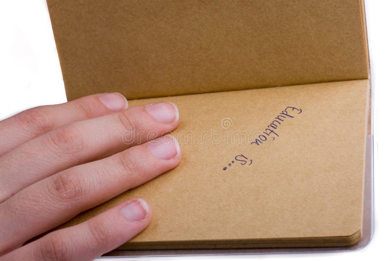 Hand holding a notebook stock image. Image of holding - 122256057