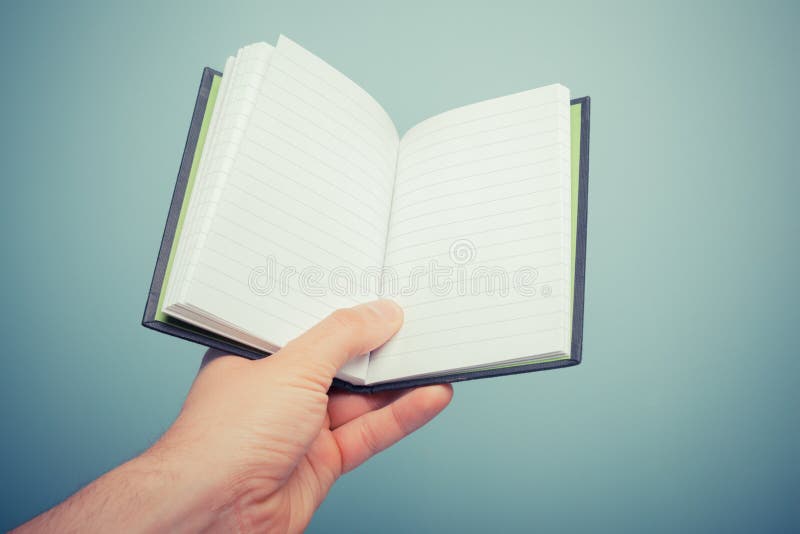 Hand holding notebook stock image. Image of diary, meeting - 40189125