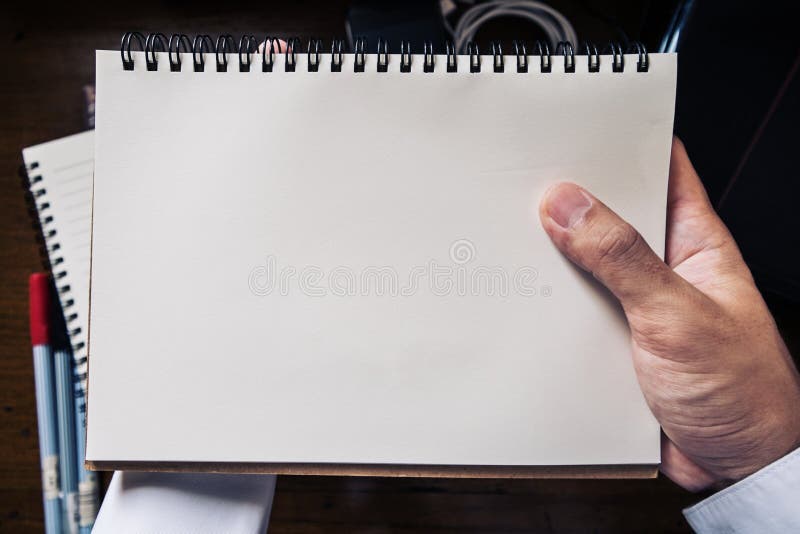 Hand holding notebook stock photo. Image of notebook - 67362744
