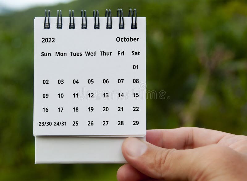 Hand Holding October 2022 Calendar with Copy Space and Nature ...