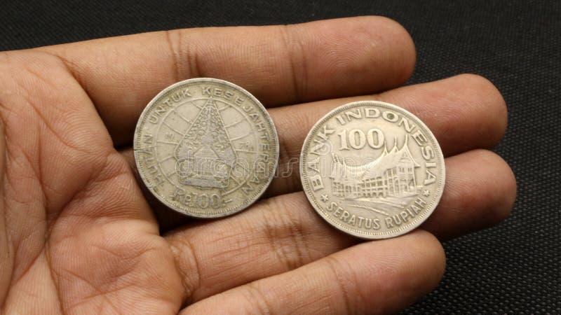 Hand Holding an Old Coin of One Hundred Rupiah Stock Image - Image of ...