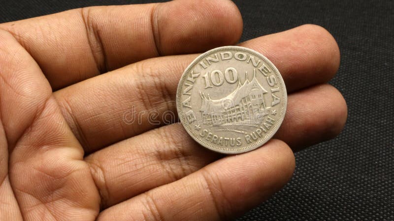 Hand Holding an Old Coin of One Hundred Rupiah Stock Image - Image of ...