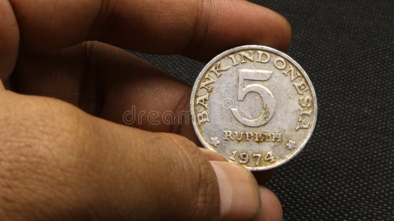 Hand Holding an Old Five Rupiah Coin Stock Photo - Image of holding ...
