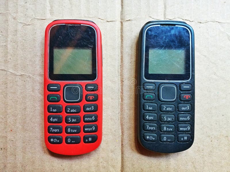 Hand Holding Old Mobile Phone with Texting or SMS Button Keyboard or ...