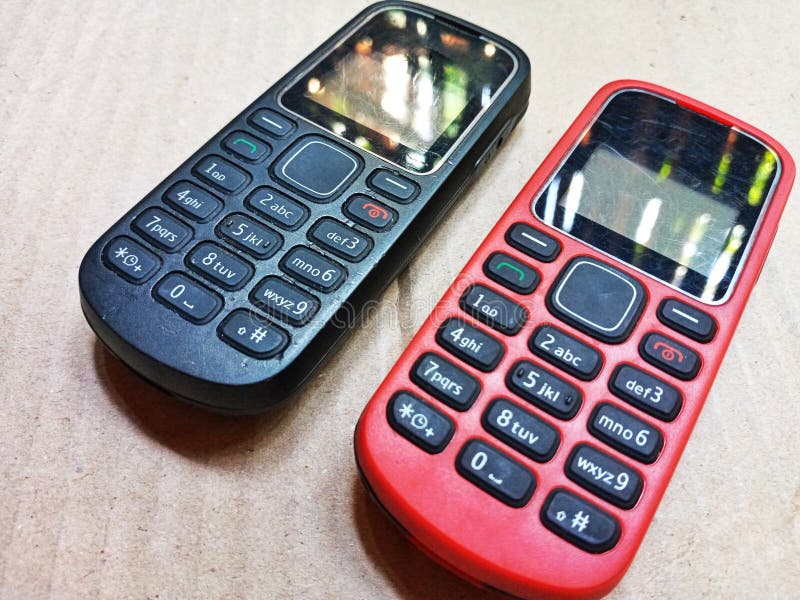 Hand Holding Old Mobile Phone with Texting or SMS Button Keyboard or ...