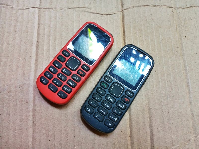 Hand Holding Old Mobile Phone with Texting or SMS Button Keyboard or ...